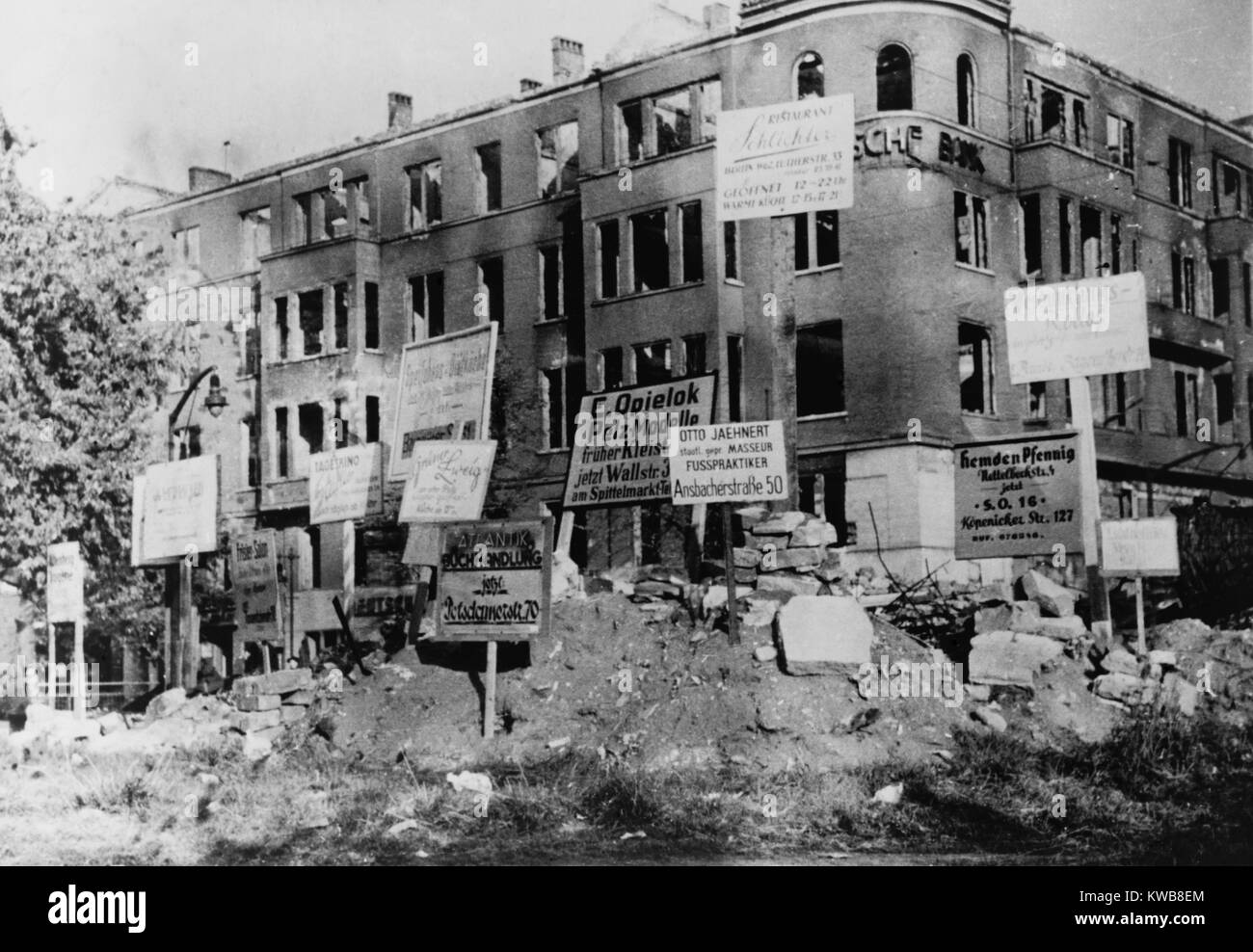 Bombed-out building in Wittenberg Platz, Berlin. Many of the signs ...