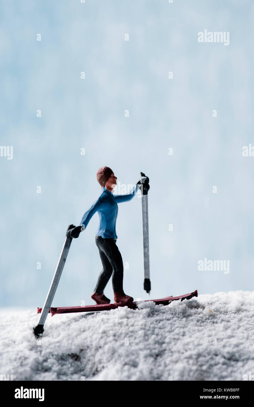 a miniature skier in a snowy landscape on winter time Stock Photo - Alamy