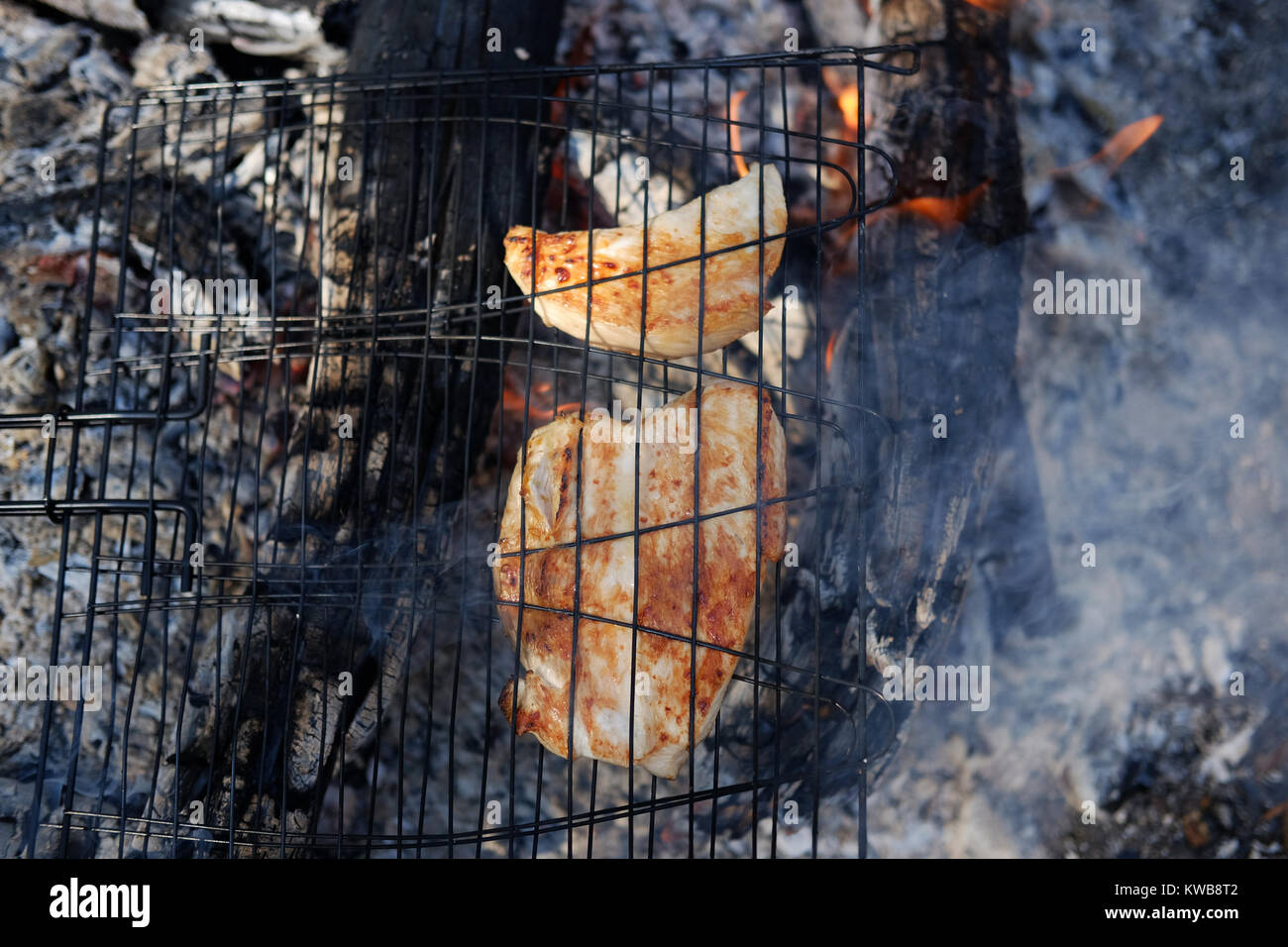 Grilled meat ona fire Stock Photo - Alamy