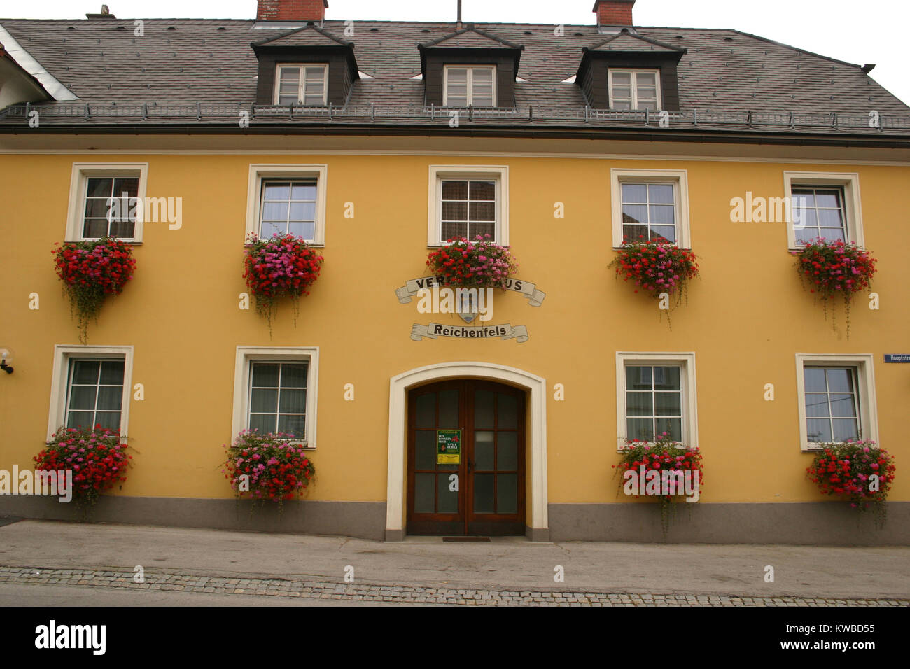 Windows with geraniums at building in Reichenfels, Austria Stock Photo ...
