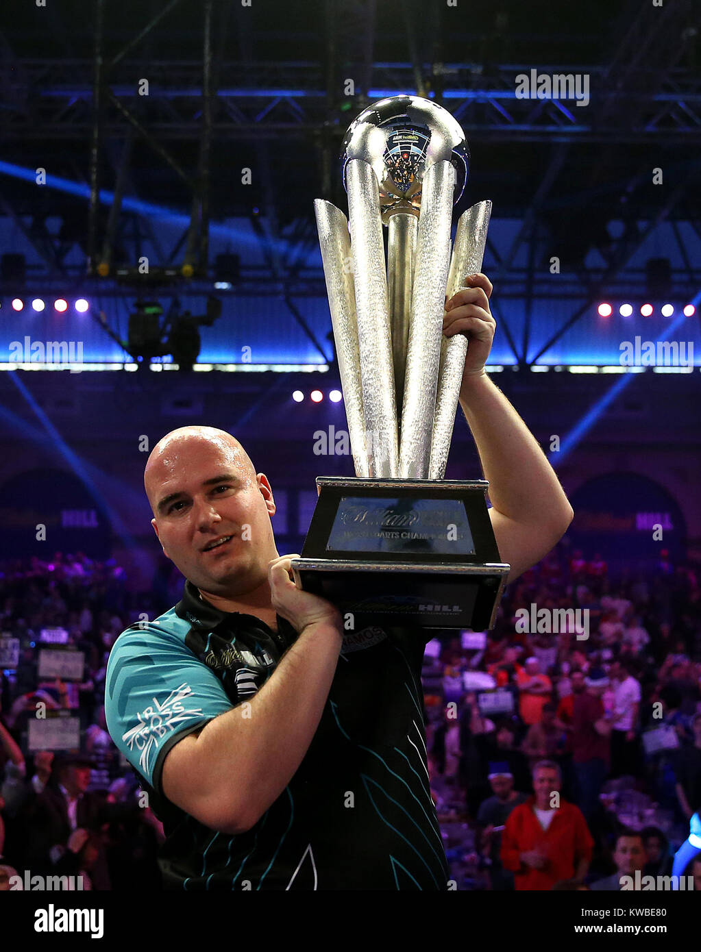 Rob Cross celebrates with the trophy after winning the final during day ...