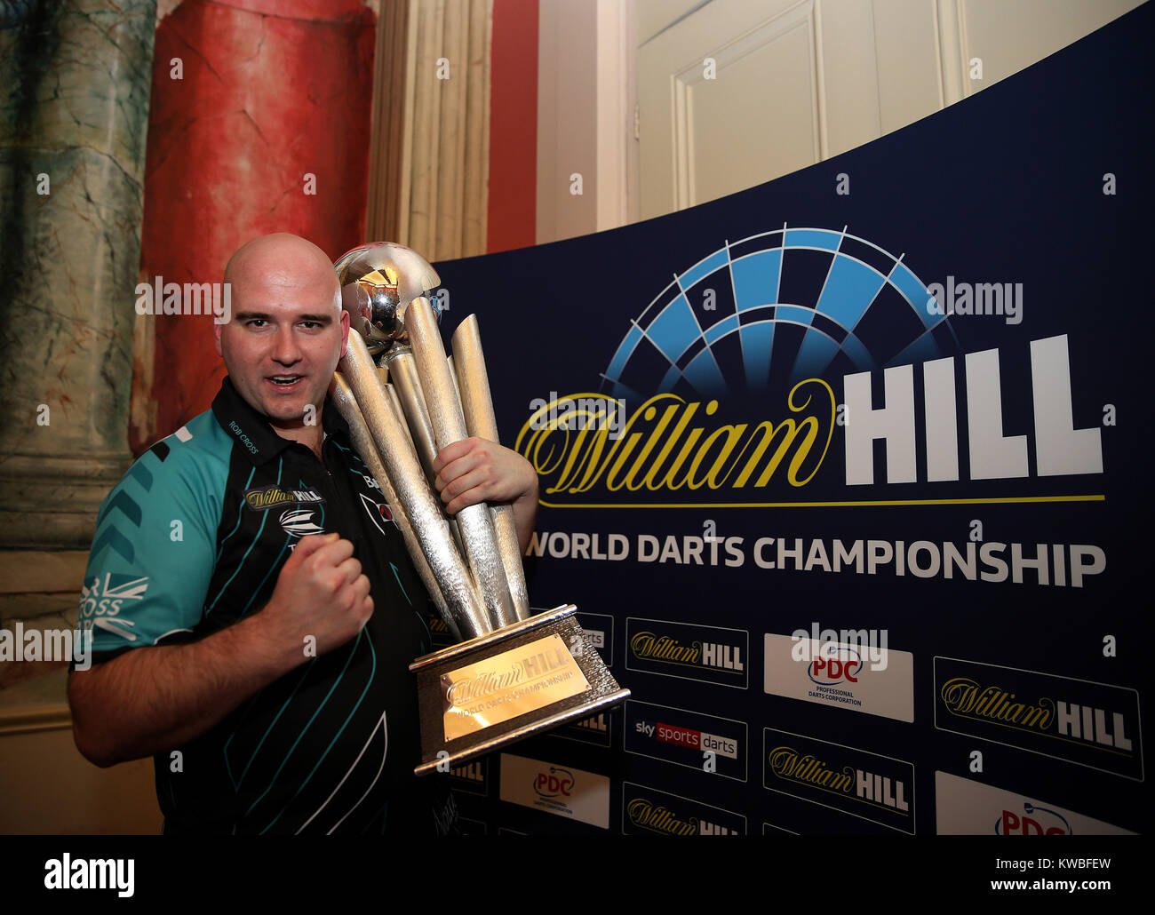 Rob Cross poses with the trophy during day fifteen of the William Hill ...