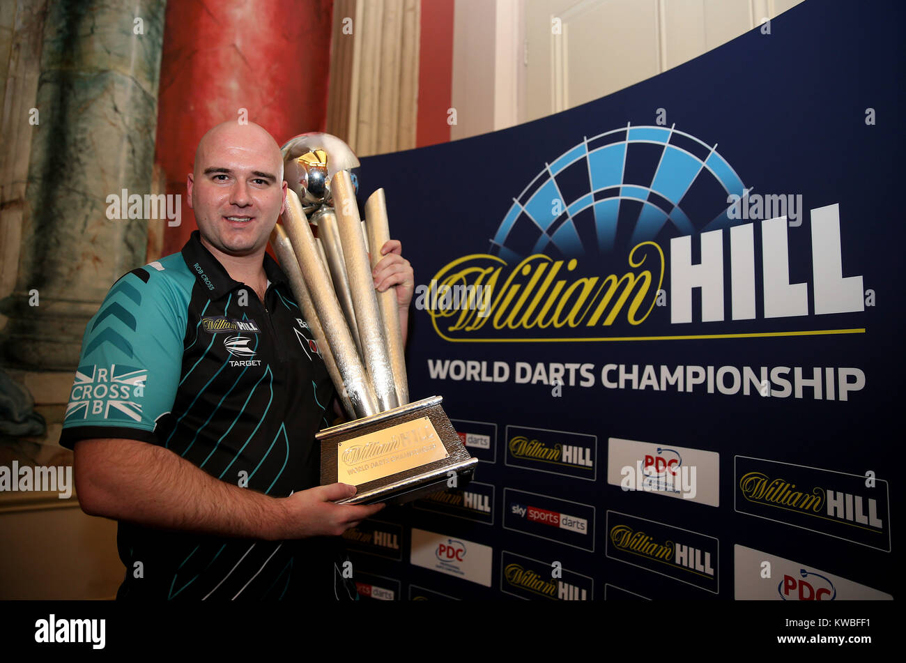 Rob Cross poses with the trophy during day fifteen of the William Hill ...
