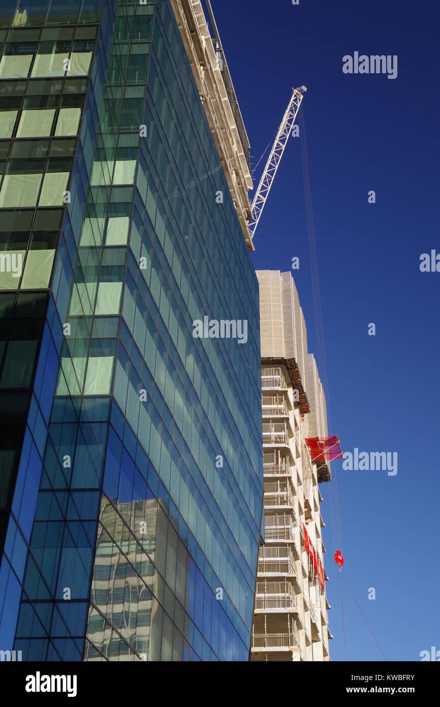 Modern New Build Glass Tower Block and Construction Crane. Architecture ...