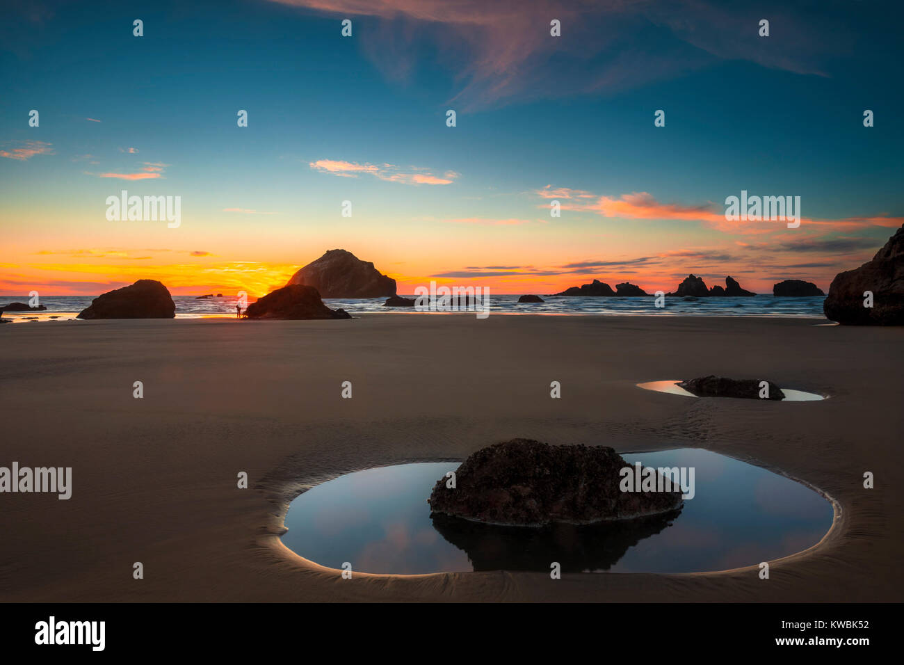 Tide pool at low tide on Oregon's Bandon Beach at sunset. A solitary ...