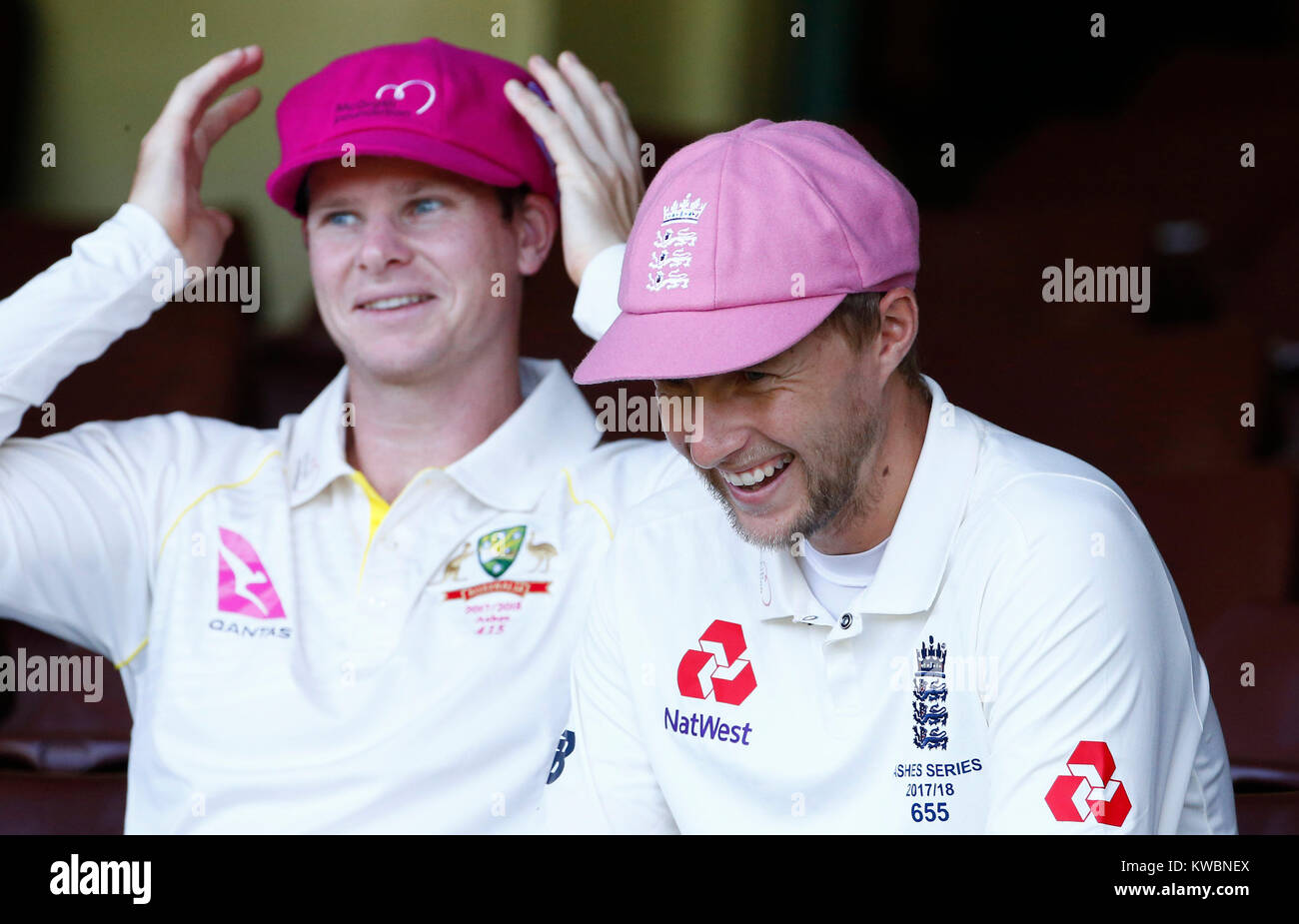 England's Joe Root along with Steve Smith wear a pink hat in support of ...