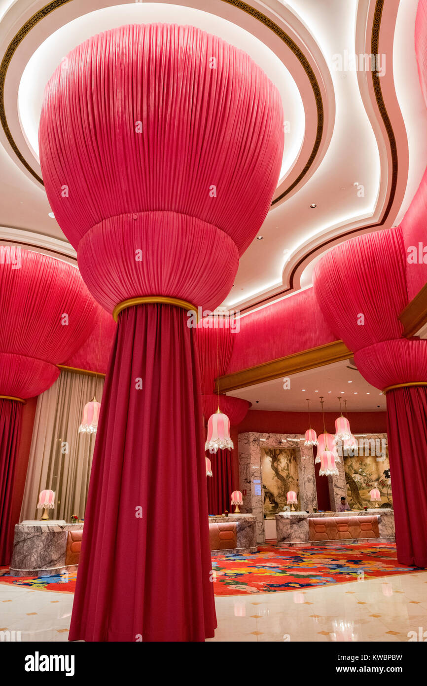 unusual ceiling roof decoration in hotel lobby, very elegant with red ...