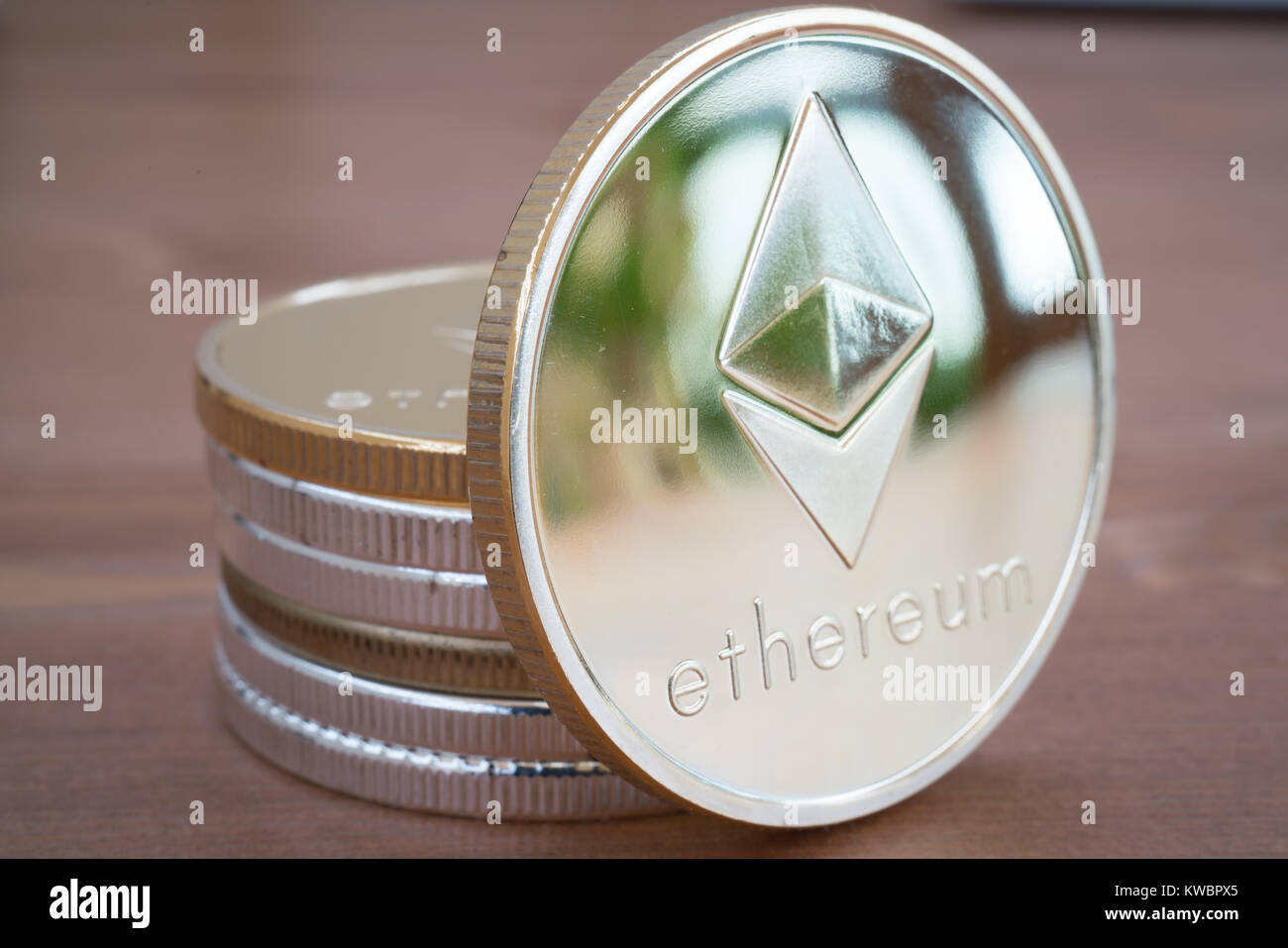 Pile of Real coin of cryptocurrency Silver Ethereum on wooden ...