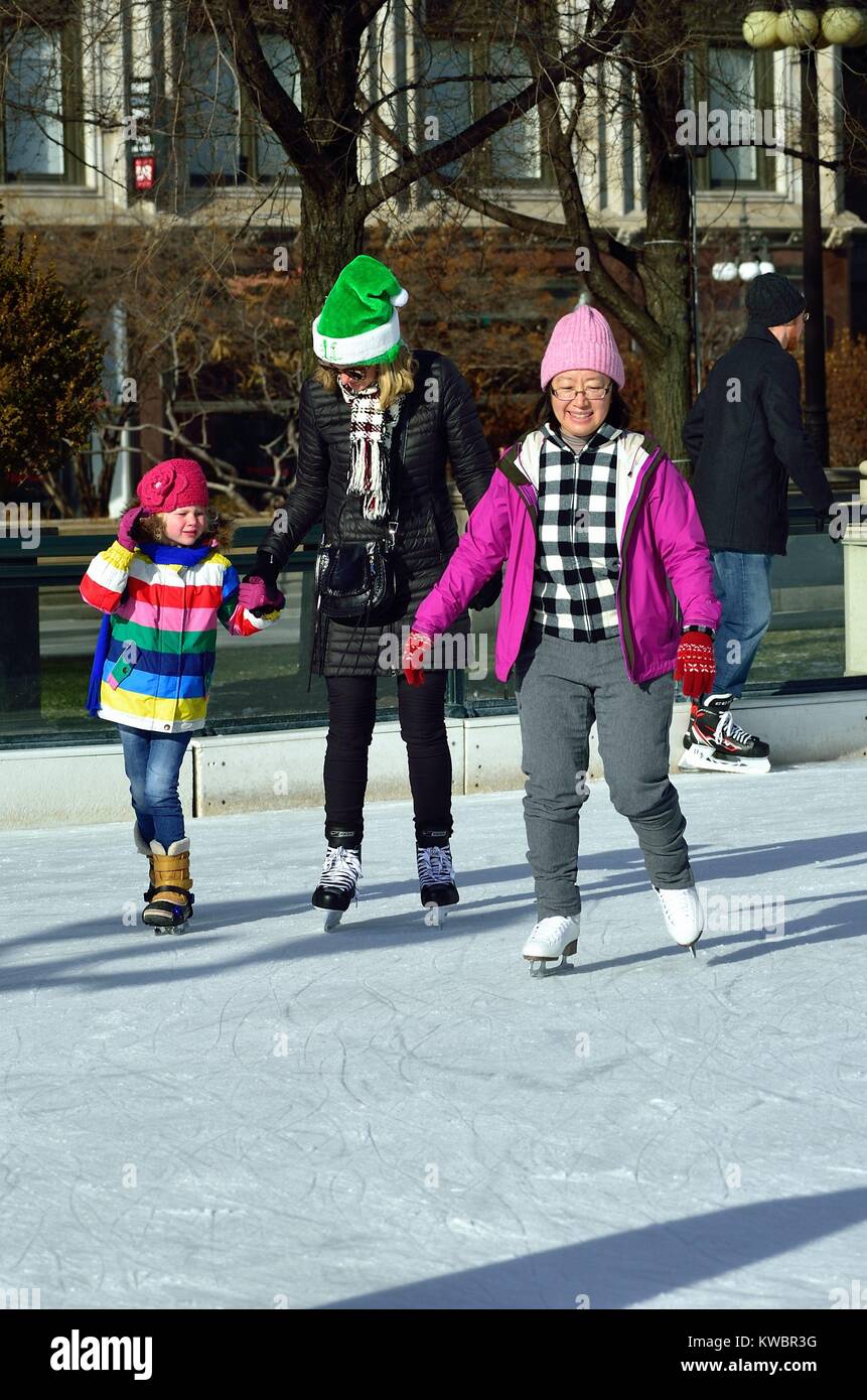 A young girl among skaters enjoying the ice rink in Chicago's ...
