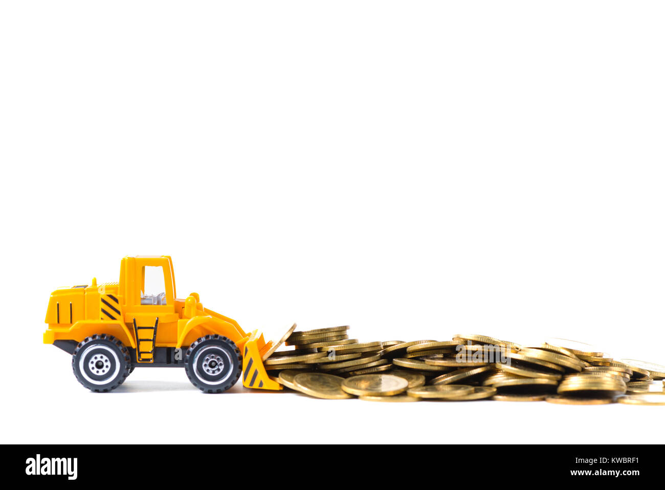 Mini bulldozer truck loading stack coin with pile of gold coin ...