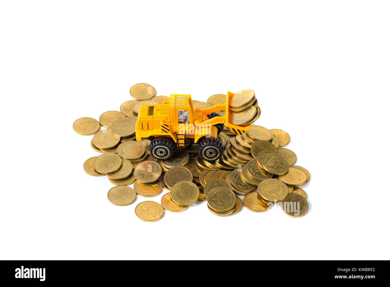 Mini bulldozer truck loading stack coin with pile of gold coin ...