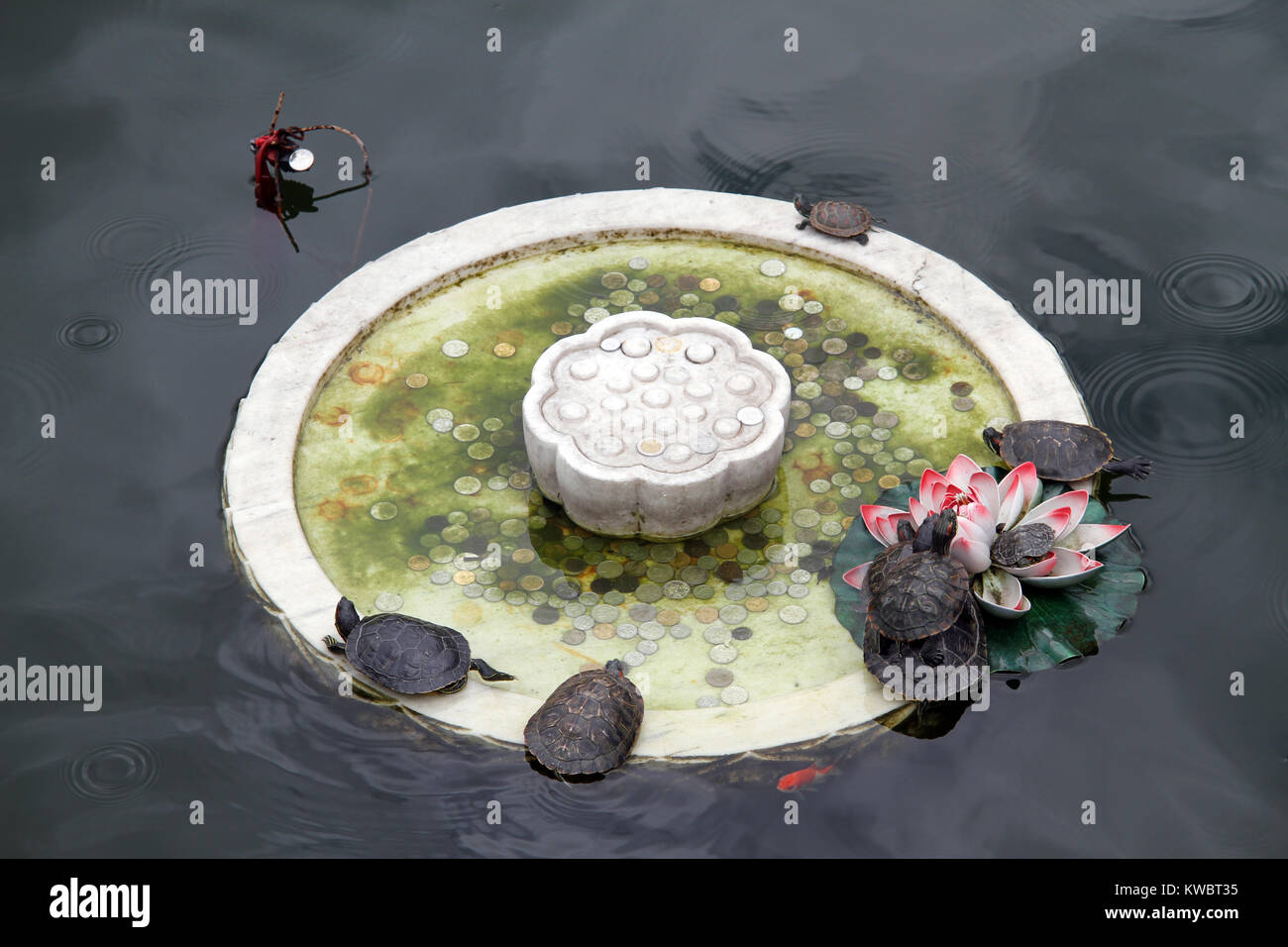 Sacral fountain with turtles Stock Photo - Alamy