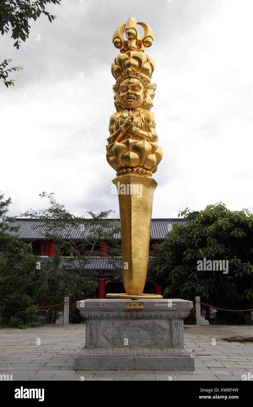 Big golden vajra in monastery ChongSheng in Dali, China Stock Photo - Alamy