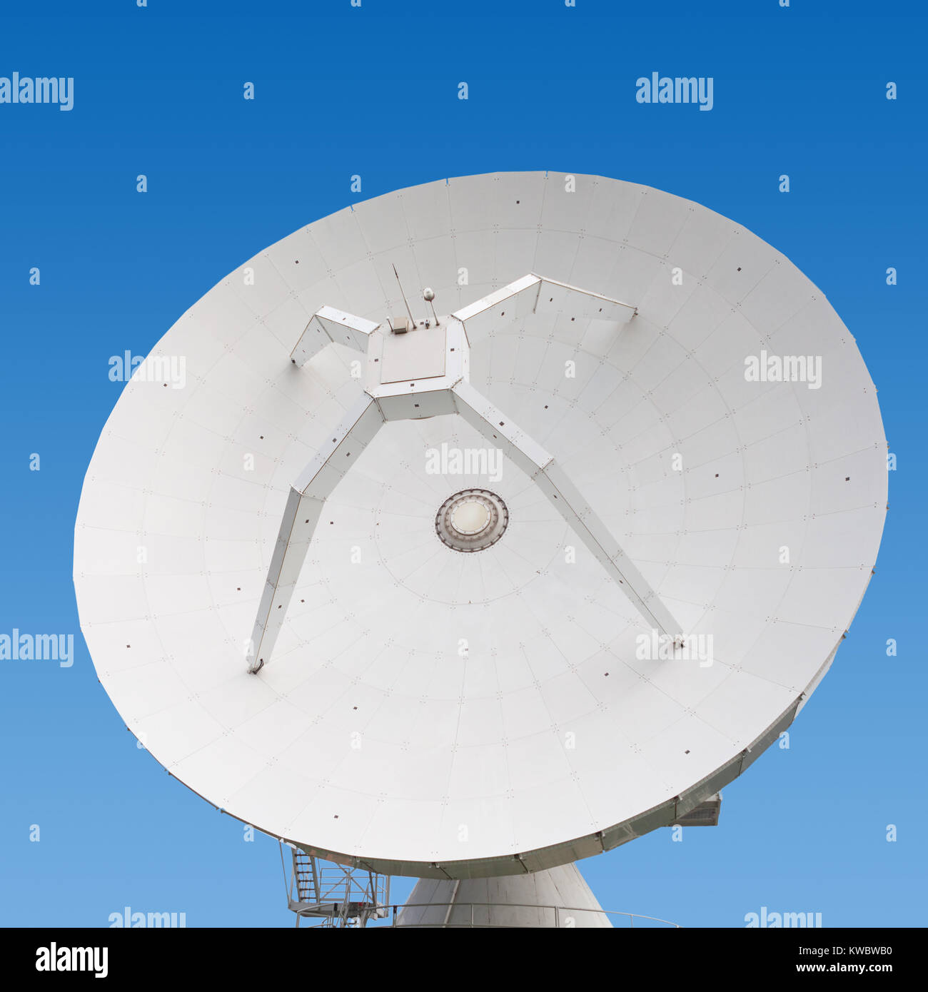 Big parabolic antenna at a day-time with blue sky behind it Stock Photo ...