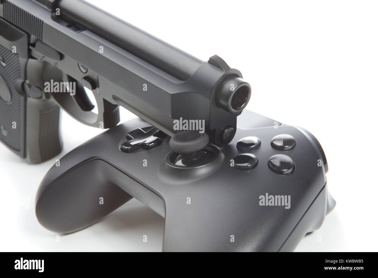 Game controller with handgun near it - virtual and real life concept ...