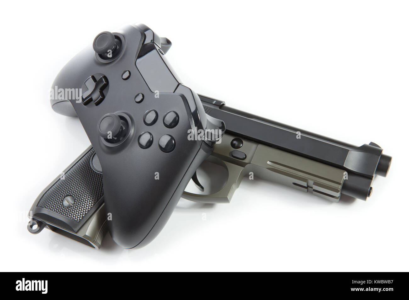 Virtual and real life concept - game controller with handgun on it ...