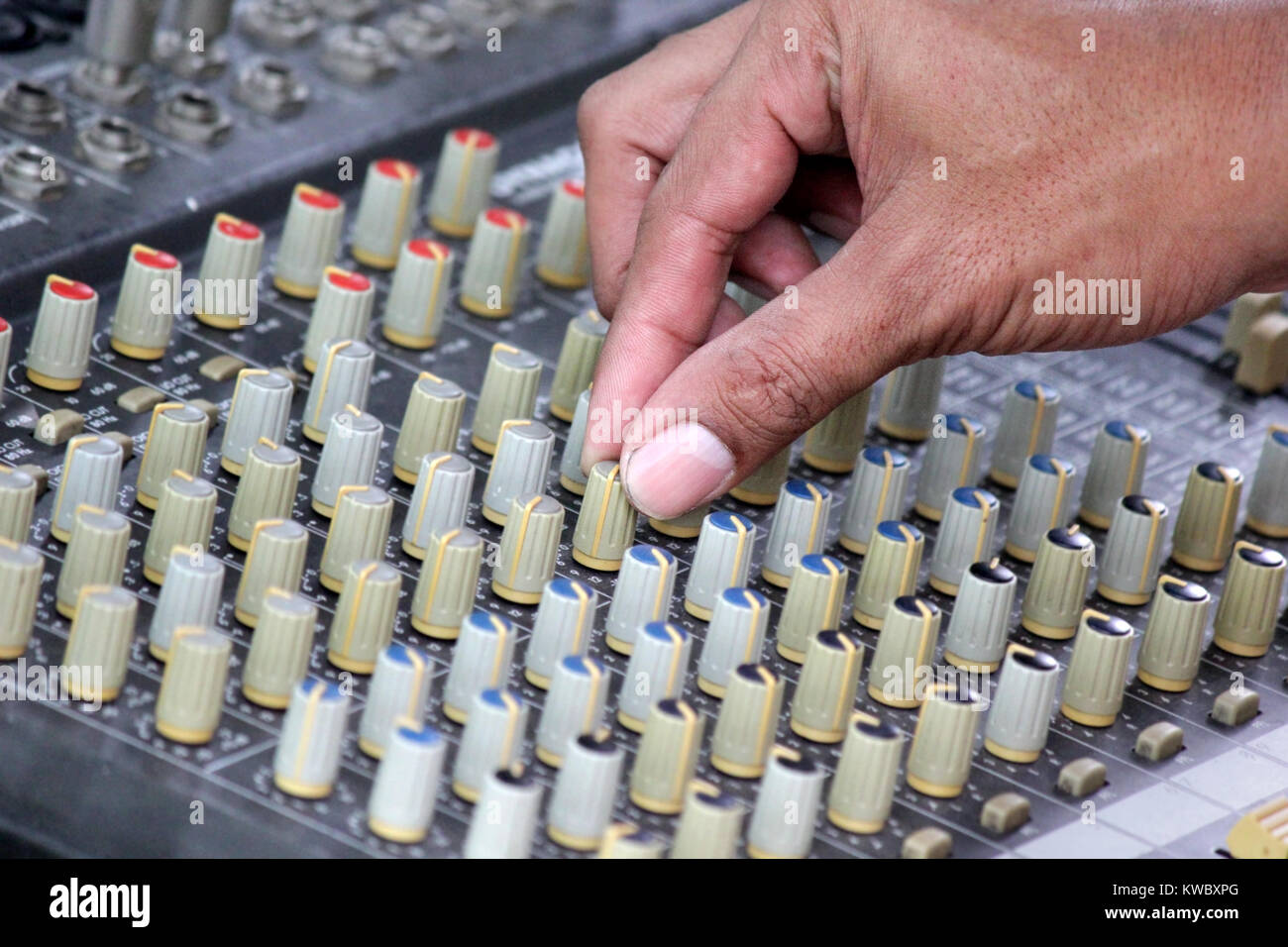 DJ mixing music on console of sound music mixer control panel Stock ...