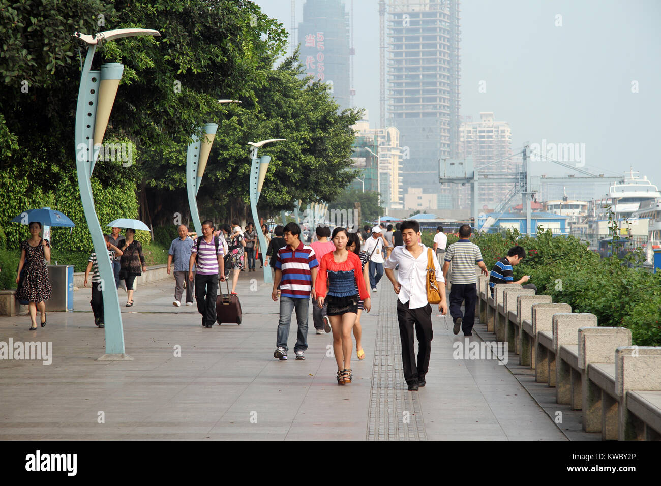 A lot of people are walking on the quay in Xiamen, China Stock Photo ...