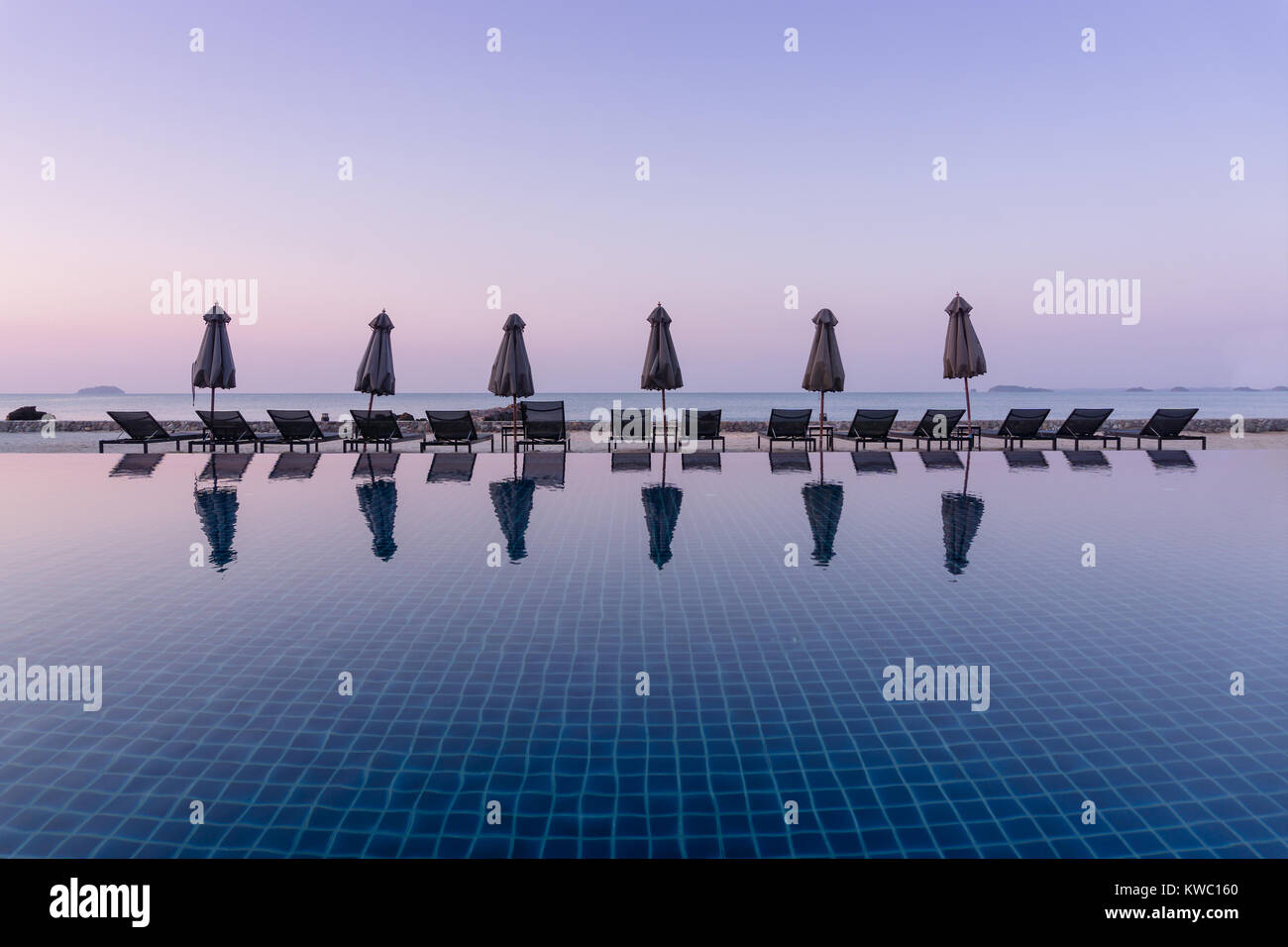 The beach side pool with bed at blue hour Stock Photo - Alamy