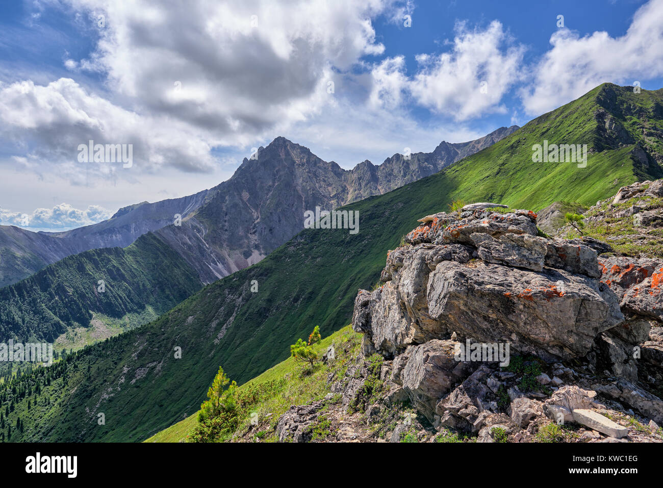 Stone fragment of rock on mountain pass. Weather erosion. Eastern Sayan ...