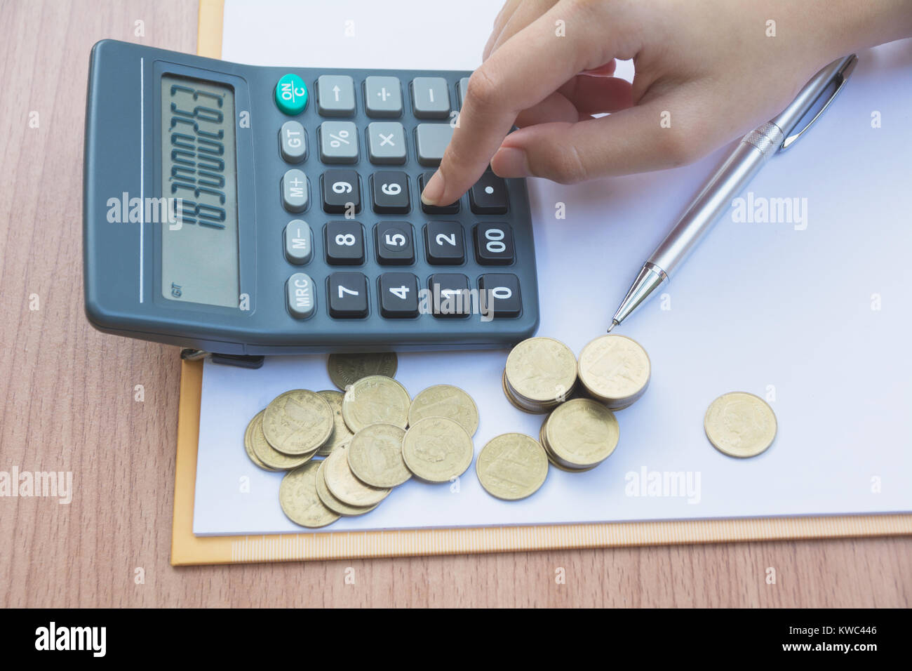 Calculator and finger pressing button hi-res stock photography and ...