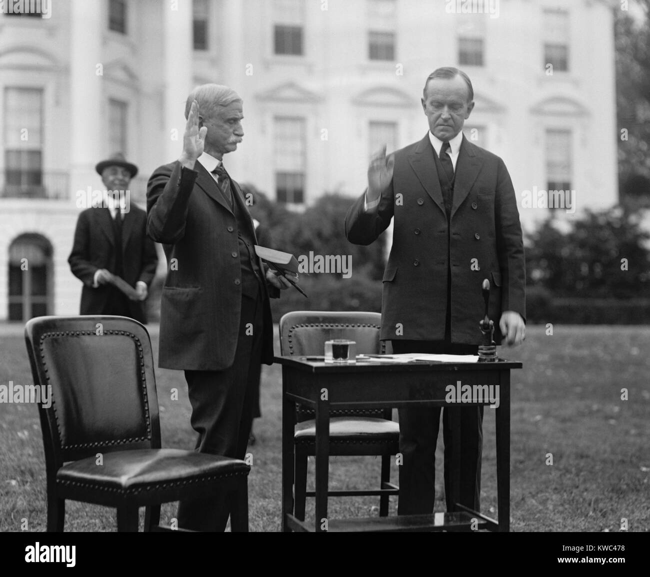 President Calvin Coolidge taking an oath before filling out his ballot ...