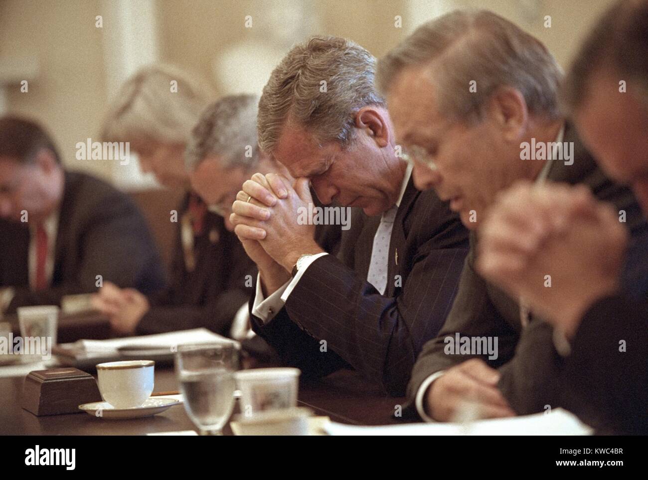 President George W. Bush opens a cabinet meeting with a prayer on Sept ...