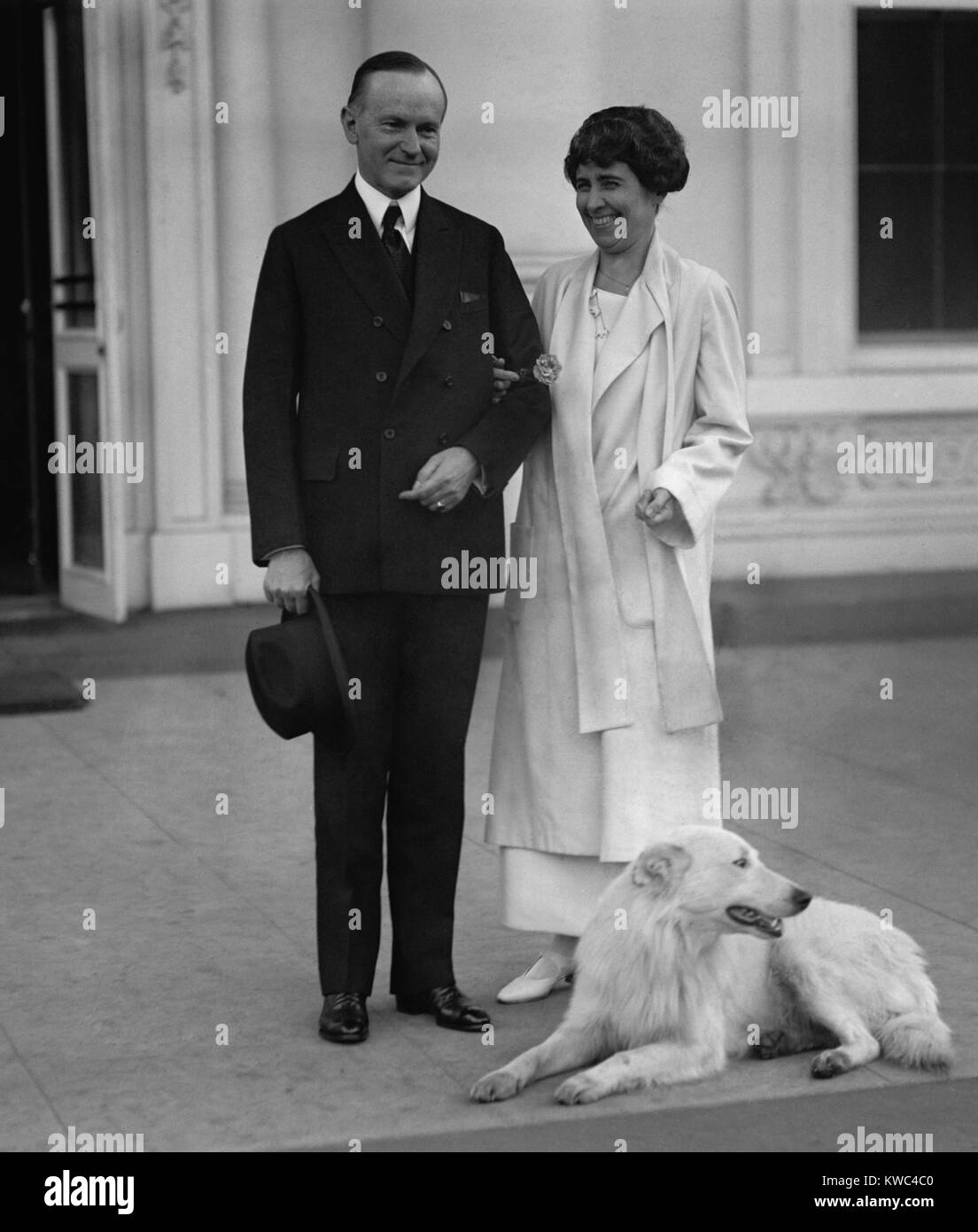President Calvin and Grace Coolidge acknowledge greetings from crowd on ...