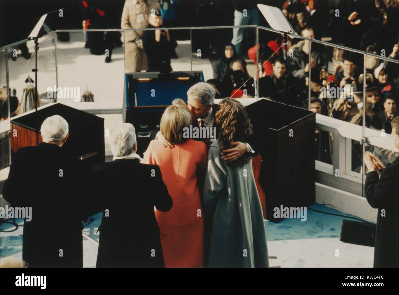 President Bill Clinton embraces his wife, Hillary, and daughter ...