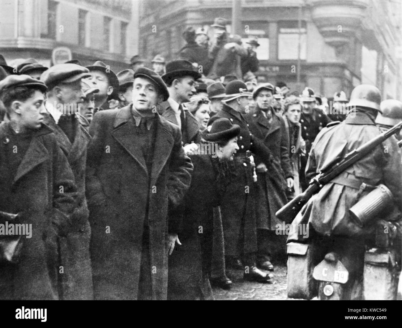 Residents of Prague, Czechoslovakia, watch invading German army, March ...