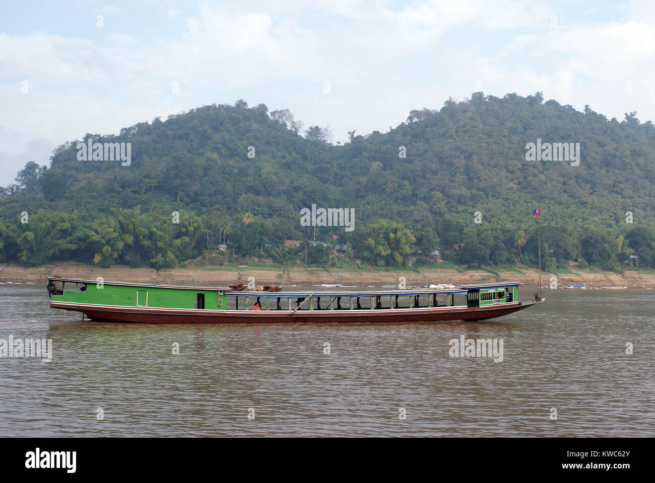 Long boat on the river in Laos Stock Photo - Alamy