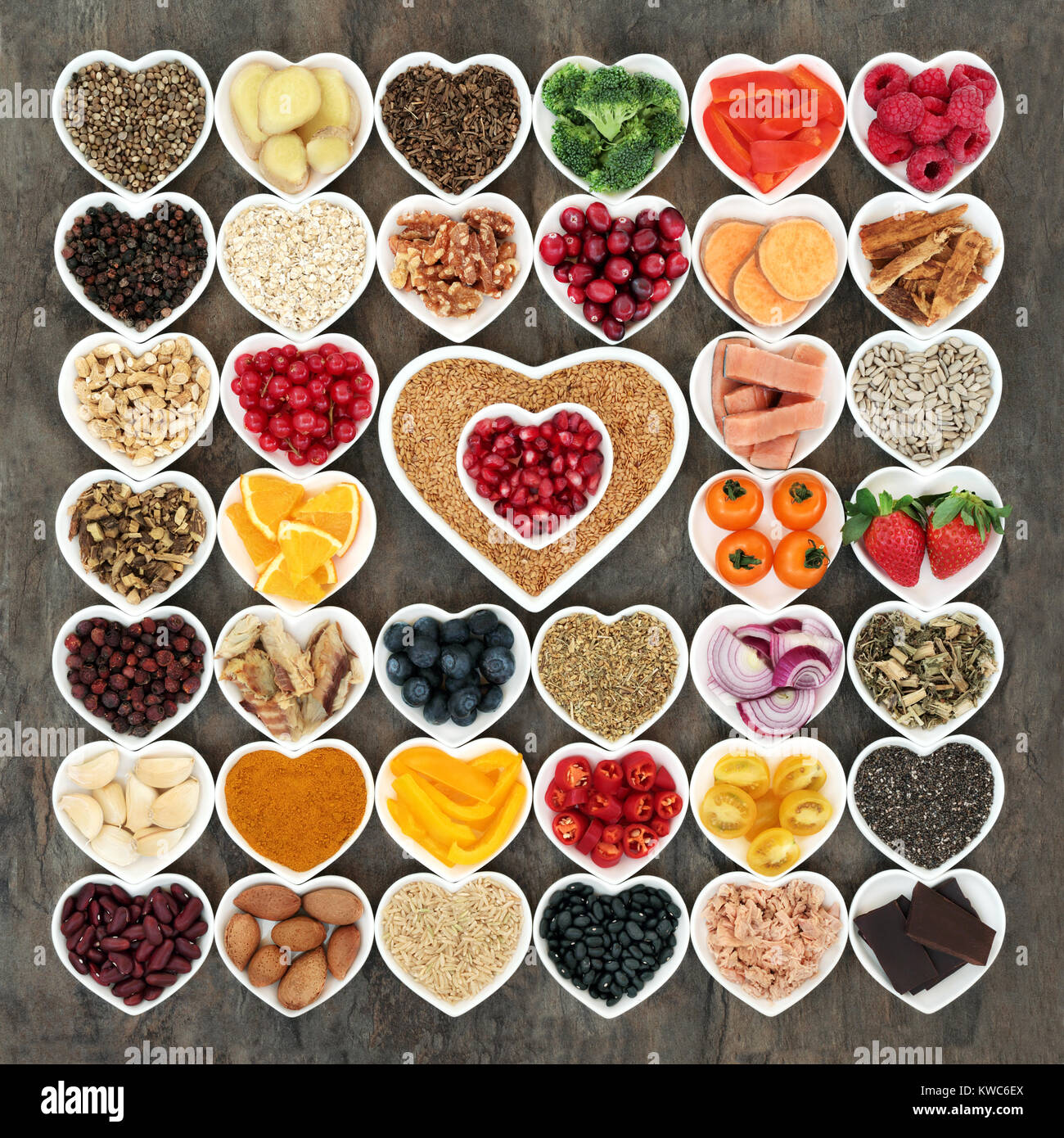 Health food for a healthy heart with vegetables, fruit, fish, nuts ...