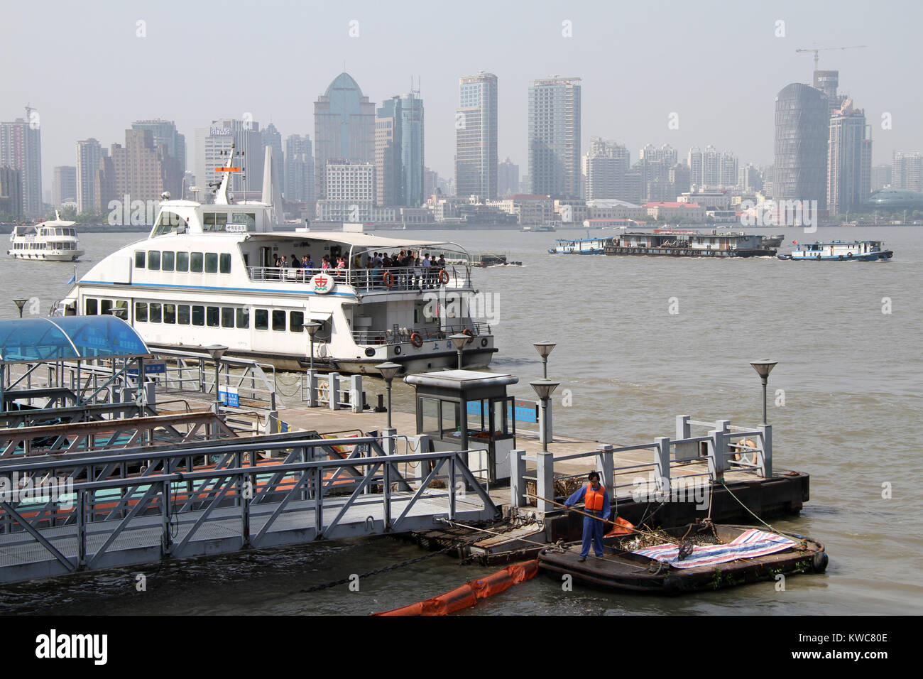 Ferry near pier on the river Huangpu in Shanghai, China Stock Photo - Alamy