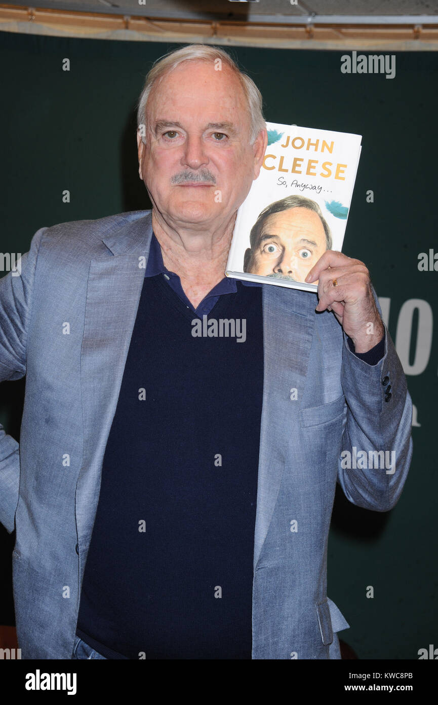 John cleese signs copies of his book hi-res stock photography and ...