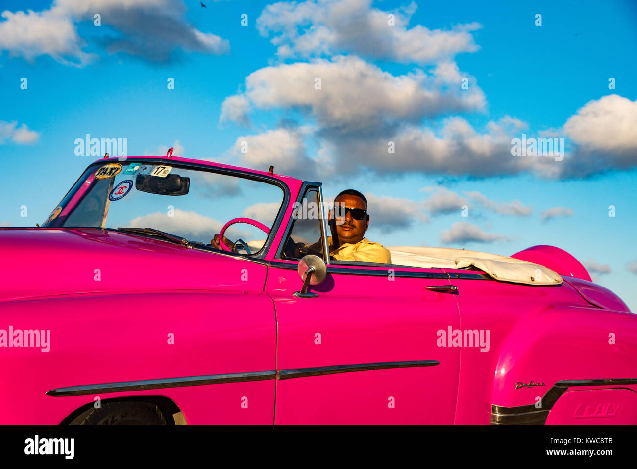 Havana, Cuba, Nov 20, 2017 - Driver sits in a pink Classic American ...