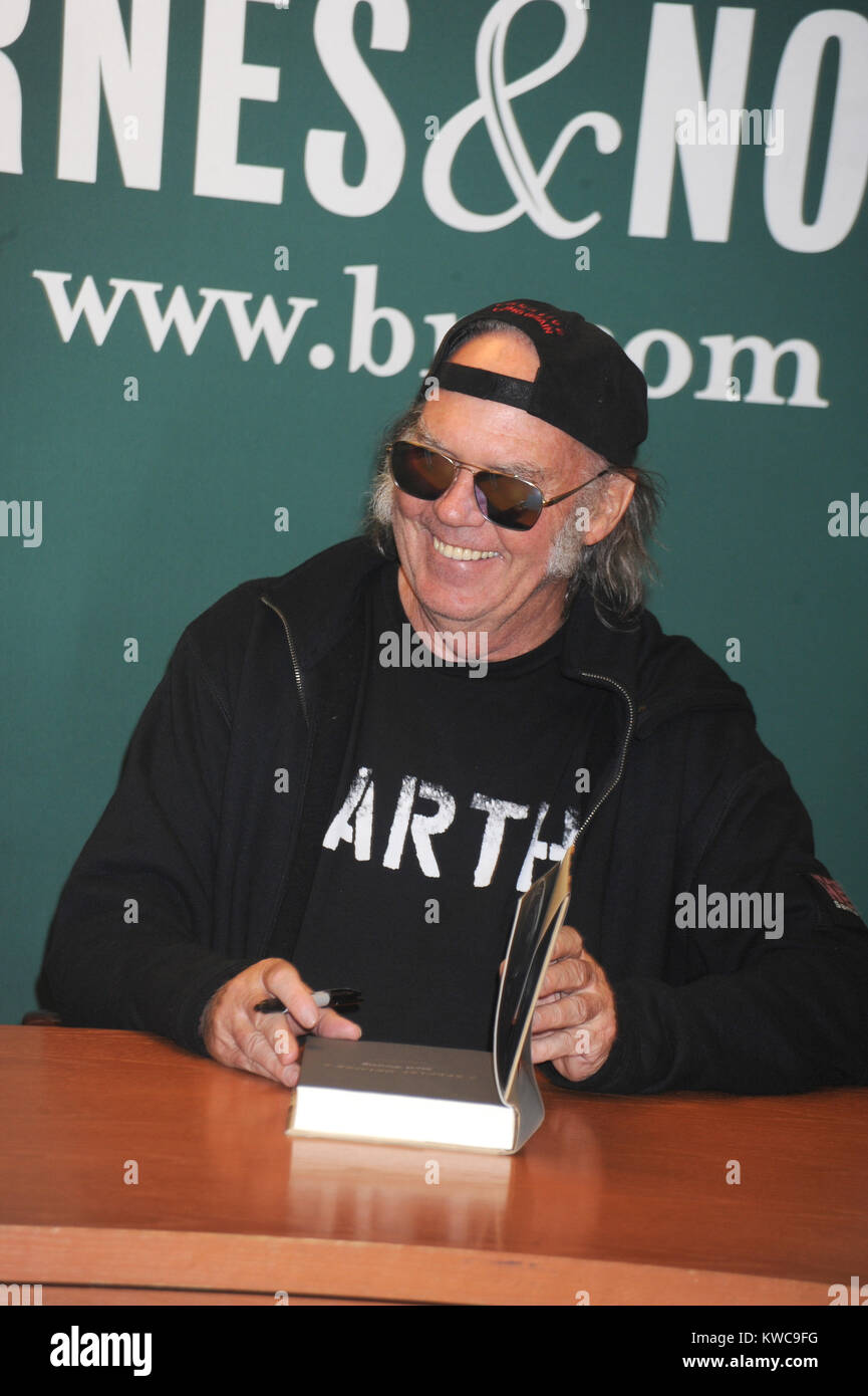 NEW YORK, NY - OCTOBER 14: Neil Young signs copies of his new book ...
