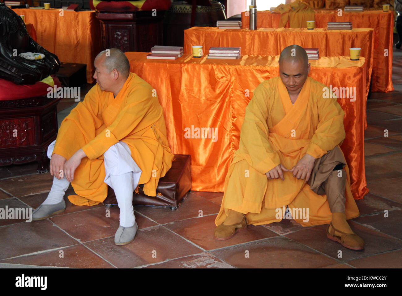 Two monks seated inside buddhist temple in Quanzhou, China Stock Photo ...