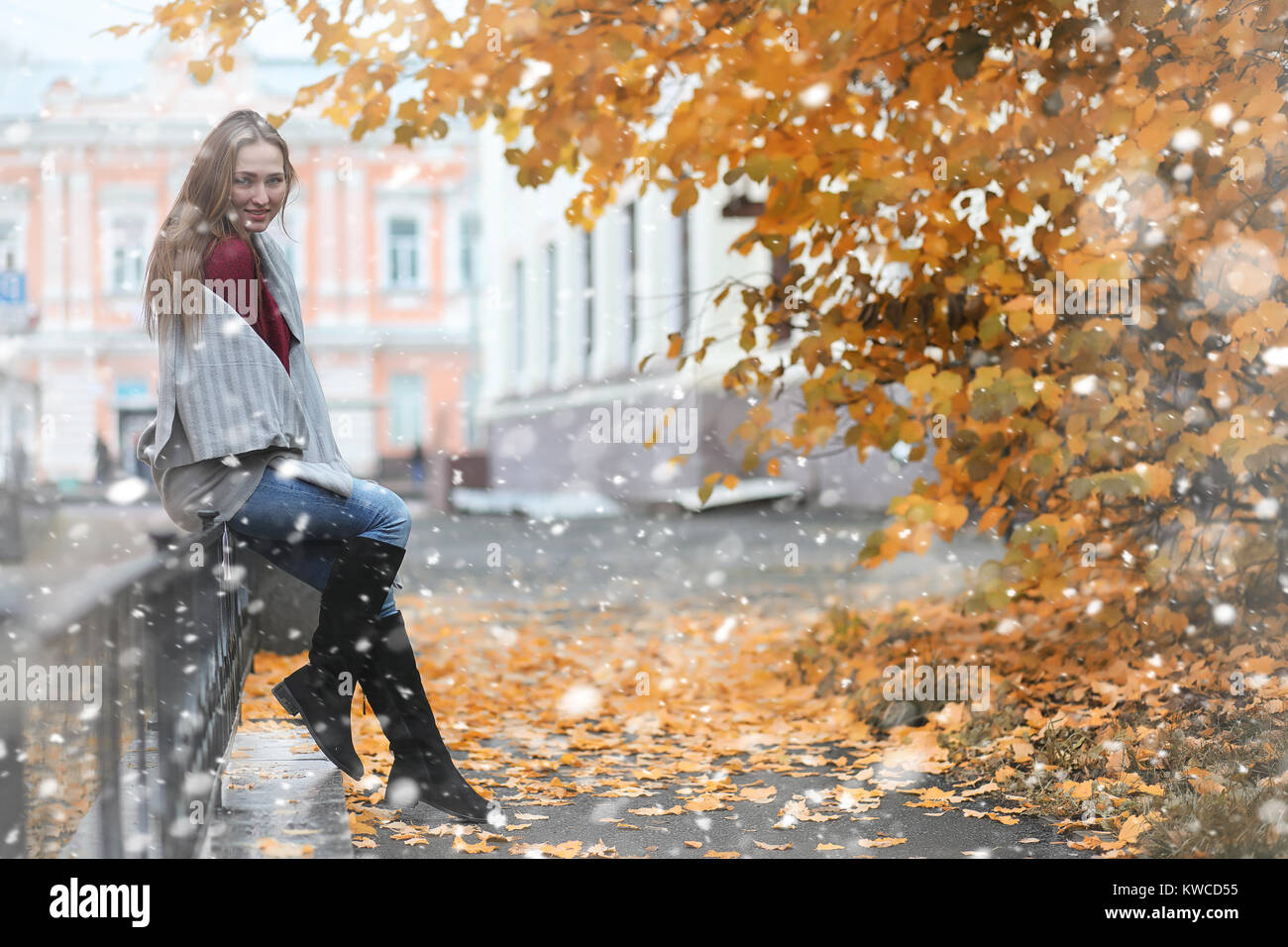 A young girl in the park on a walk in the first snowfall Stock Photo ...