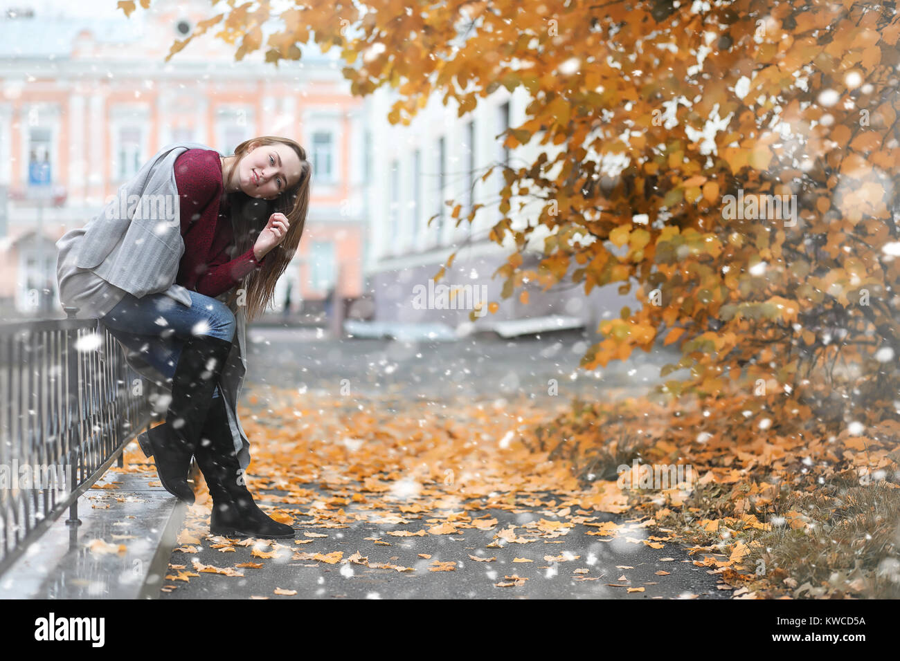 A young girl in the park on a walk in the first snowfall Stock Photo ...