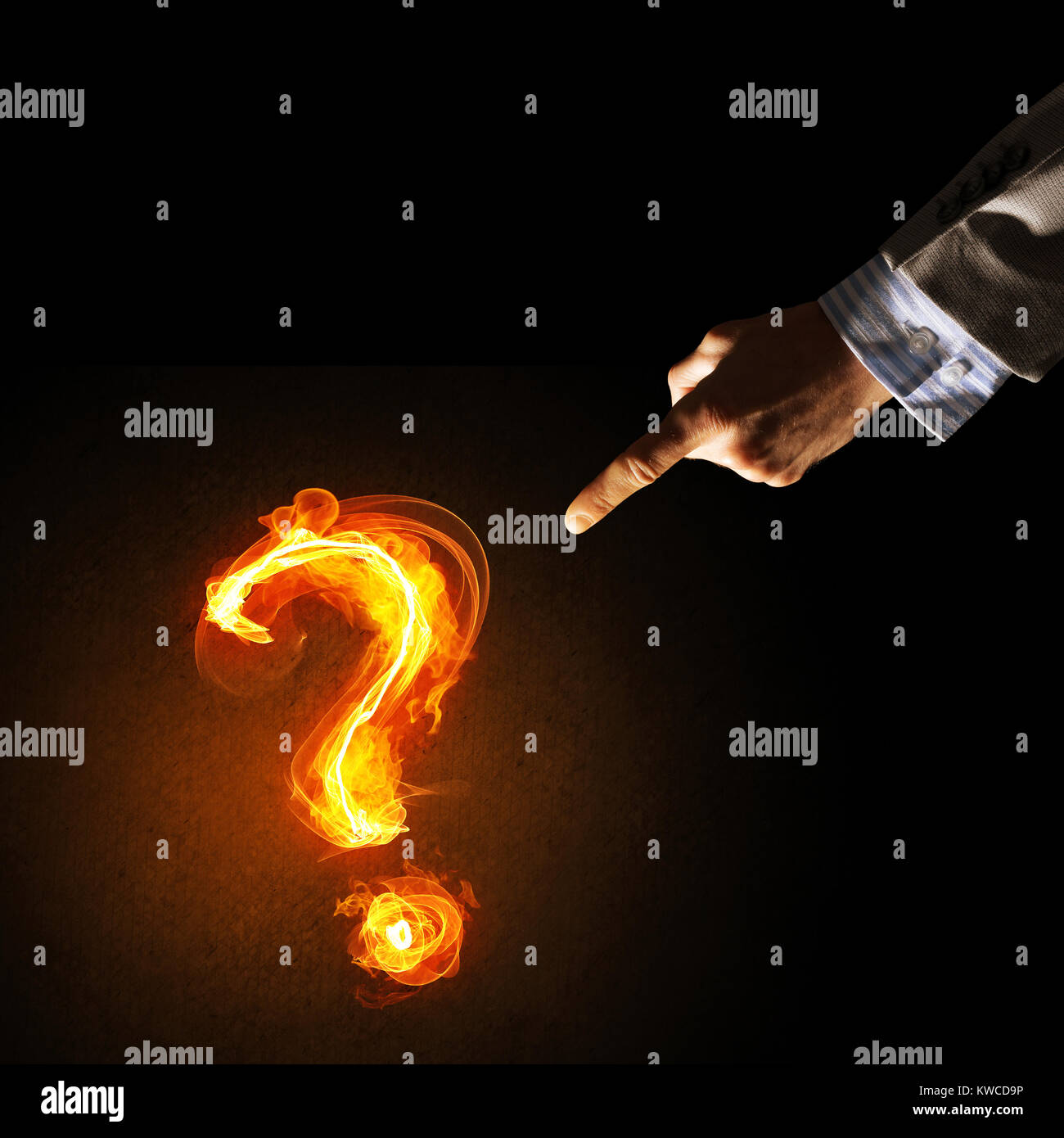 Close of businessman hand showing burning fire sign on dark background ...