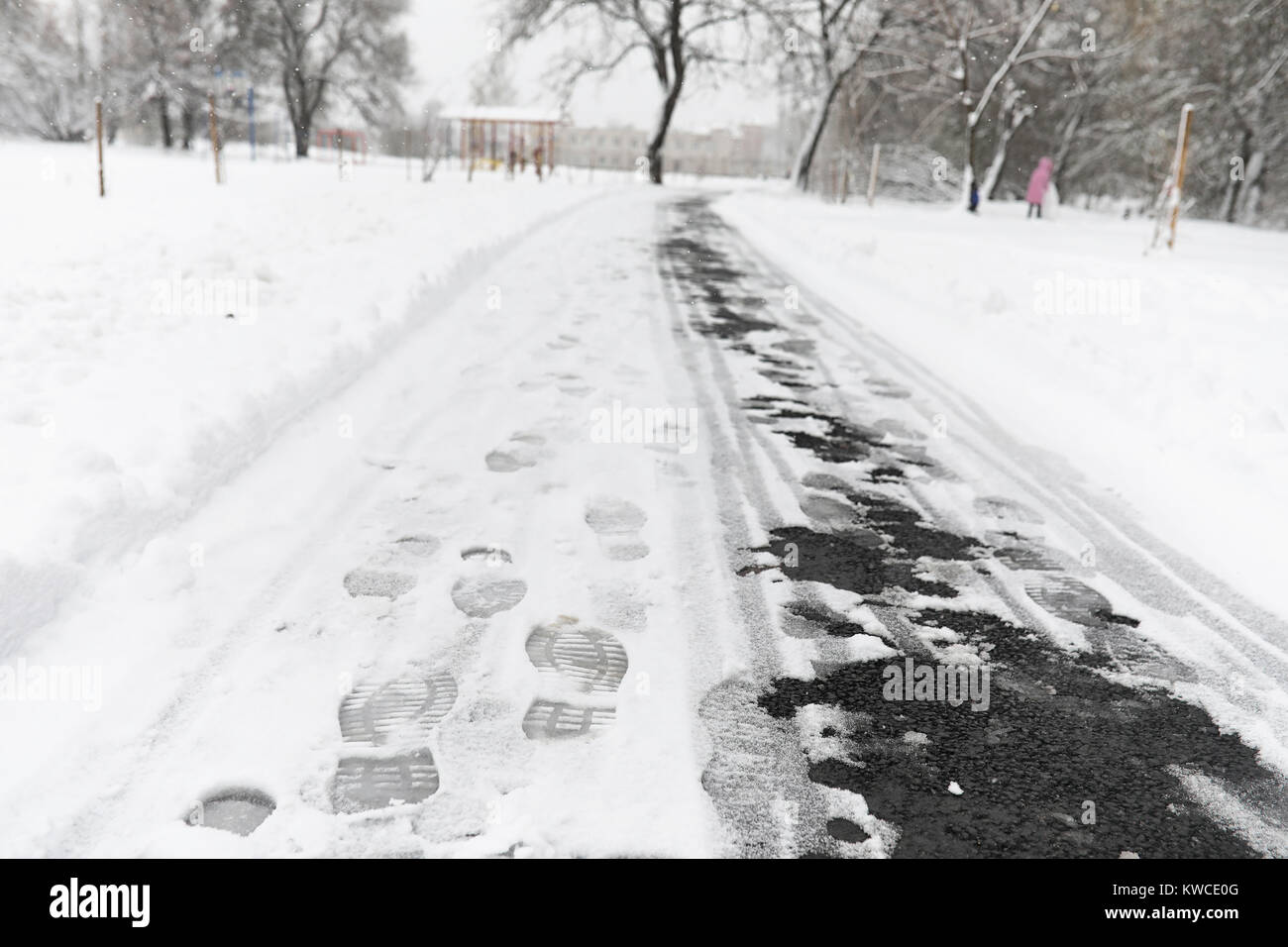 Footprints in the snow. Footprints on the first snow. Imprint of shoes ...