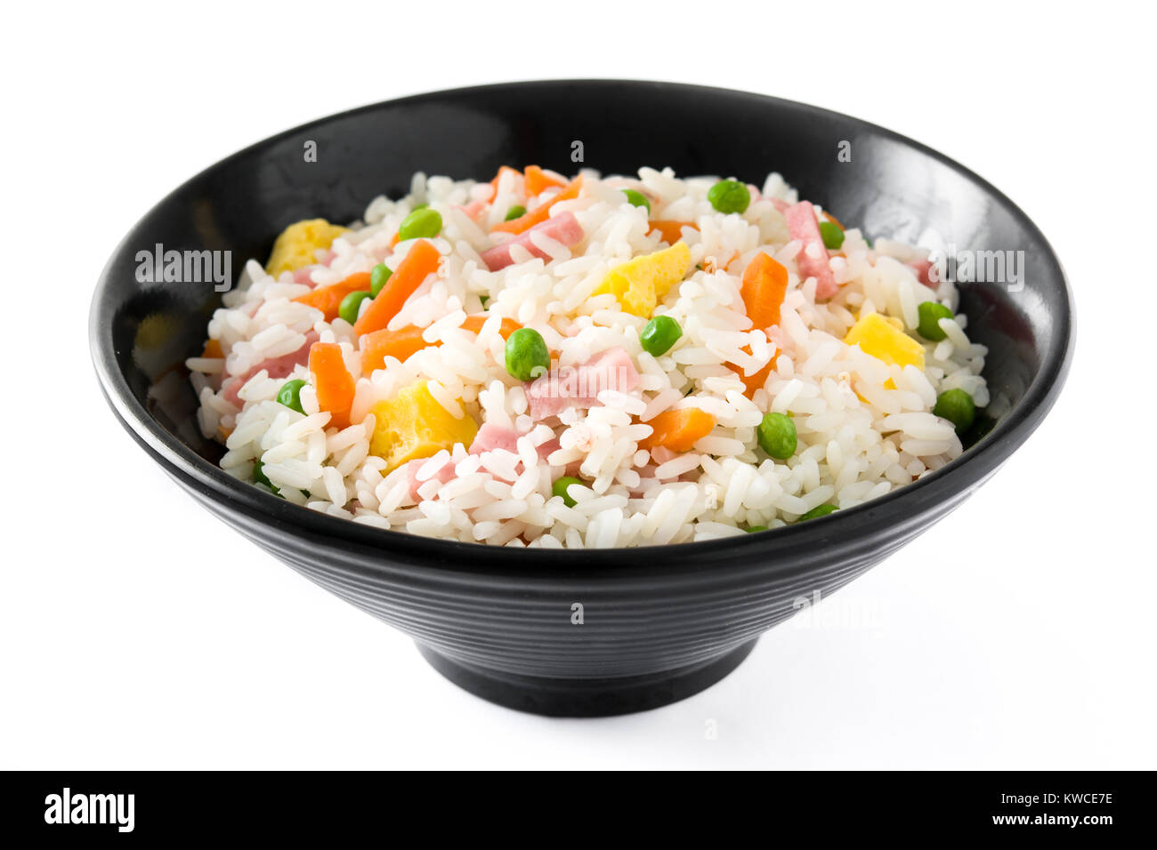 Chinese fried rice with vegetables and omelette in black bowl isolated ...