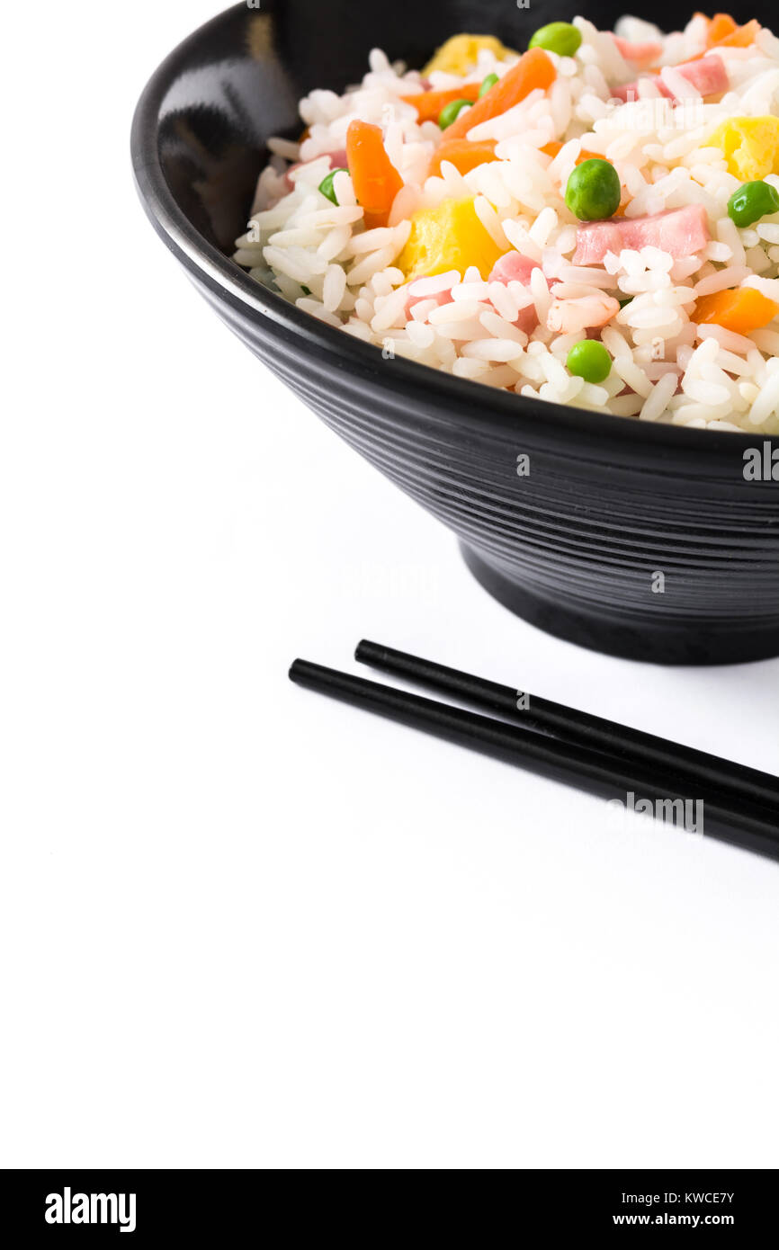 Chinese fried rice with vegetables and omelette in black bowl isolated ...