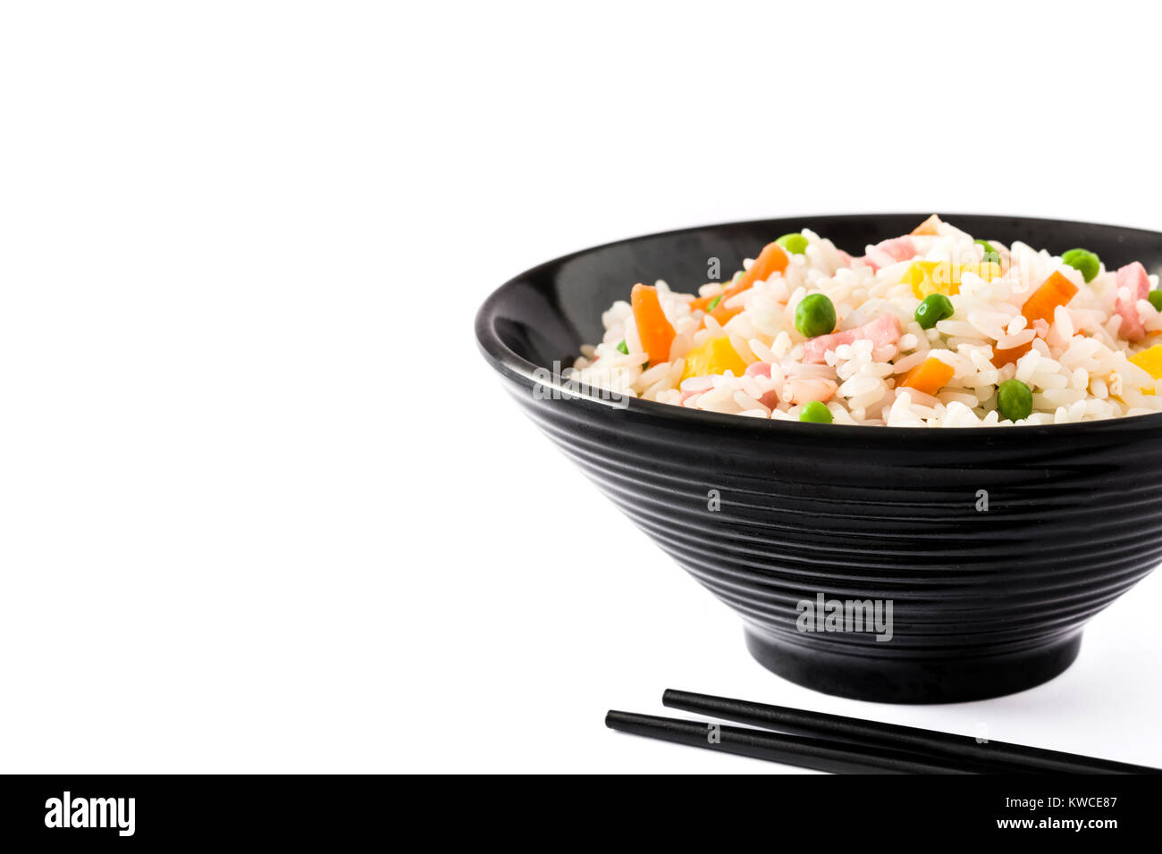 Chinese fried rice with vegetables and omelette in black bowl isolated ...