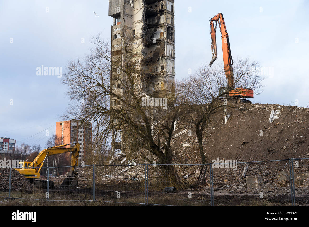 Building demolition with hydraulic excavator Stock Photo - Alamy