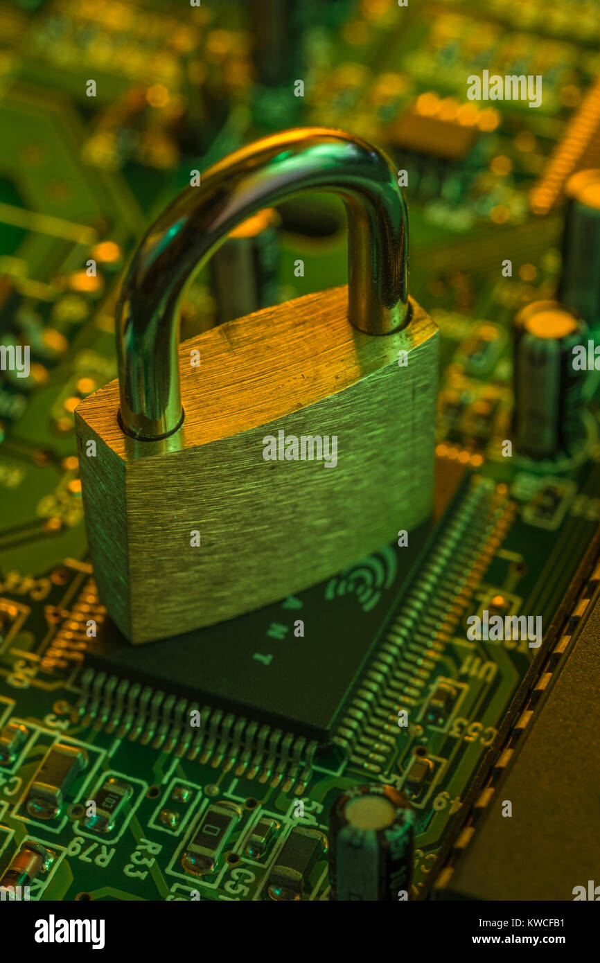 Padlock resting on a circuit-board. For concept of secure data, email ...