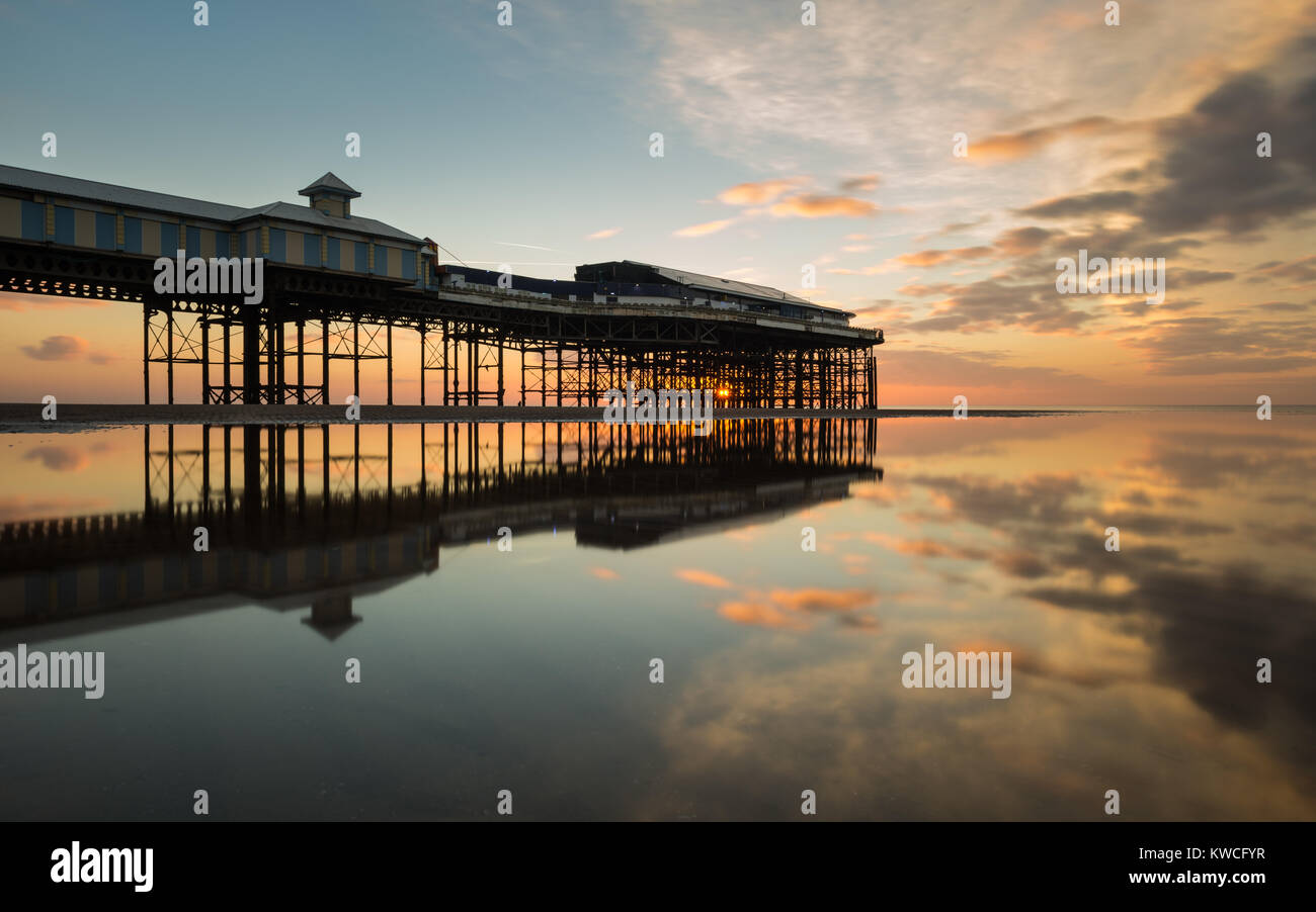 Central Pier Blackpool with sunset & reflection in water Stock Photo ...