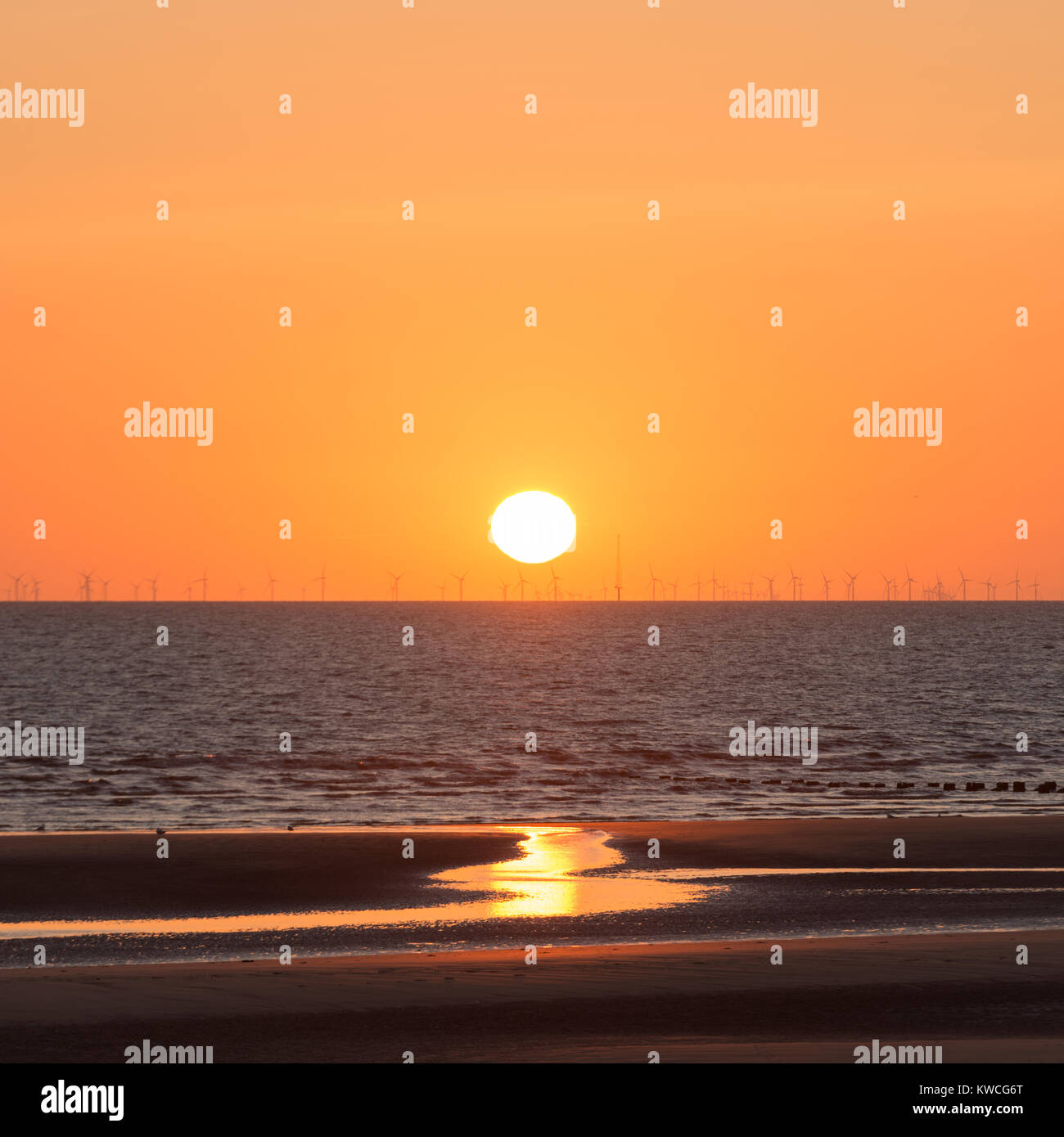 Blackpool sunset & reflection on beach Stock Photo - Alamy
