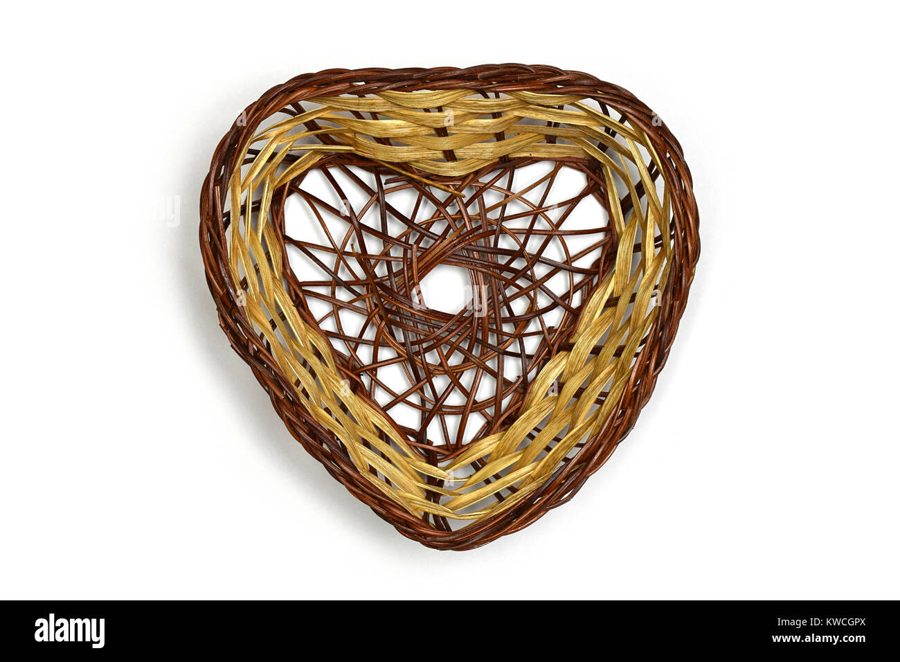 Heart-shaped wicker basket on a white background Stock Photo - Alamy