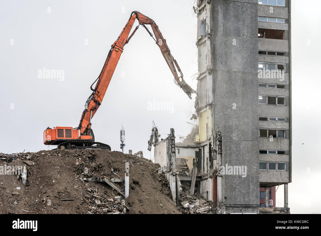 highrise industrial building demolition with hydraulic excavator Stock ...